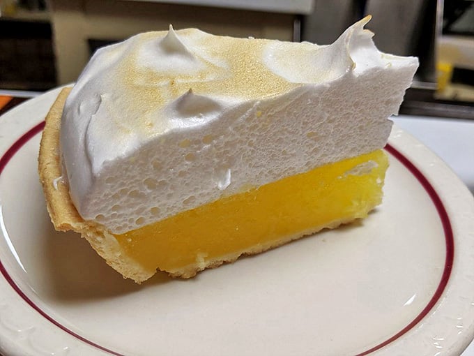 Lemon meringue pie with peaks so perfect they'd make the Alps jealous. Sunshine on a plate, one slice at a time.
