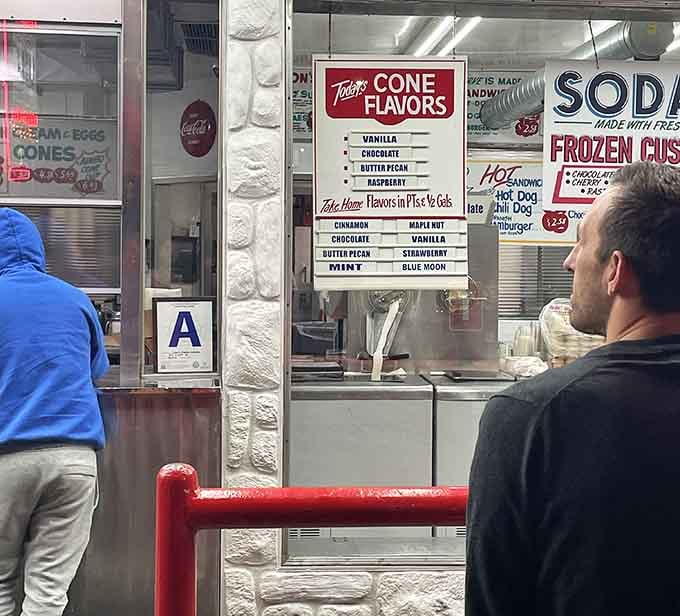 The classic drive-in setup with its distinctive overhang looks like it rolled straight out of American Graffiti's best scenes.