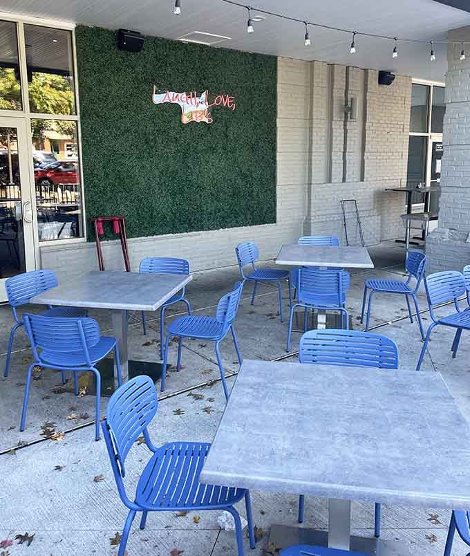 Outdoor patio seating with cheerful blue chairs, perfect for enjoying Maryland weather with your favorite breakfast.