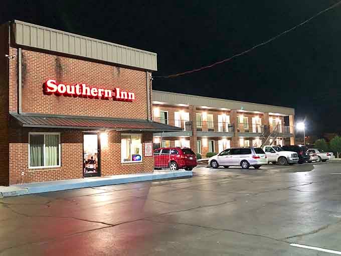 The Southern Inn glows welcomingly at night, ready to provide rest for weary travelers who finally took that exit.