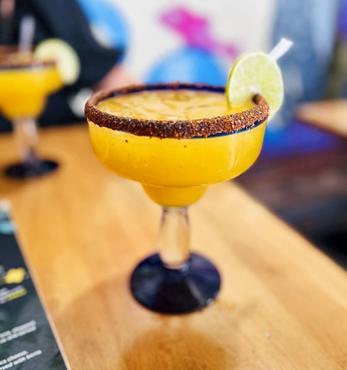 This isn't just any margarita&mdash;it's liquid sunshine with a chili-salt rim. The perfect balance of sweet, tart, and kick to complement your meal.