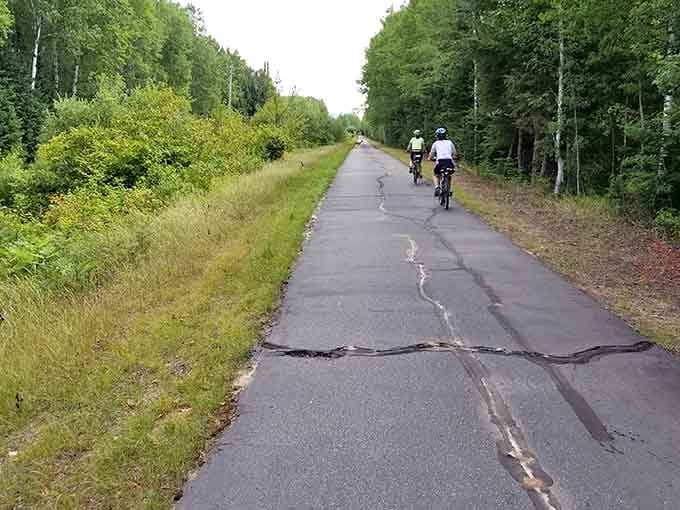 The Mesabi Trail stretches toward the horizon, offering cyclists and hikers a paved path through northern Minnesota's stunning natural beauty.