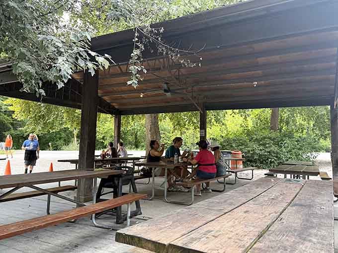 Outdoor seating under the trees turns every meal into a celebration of mountain life.