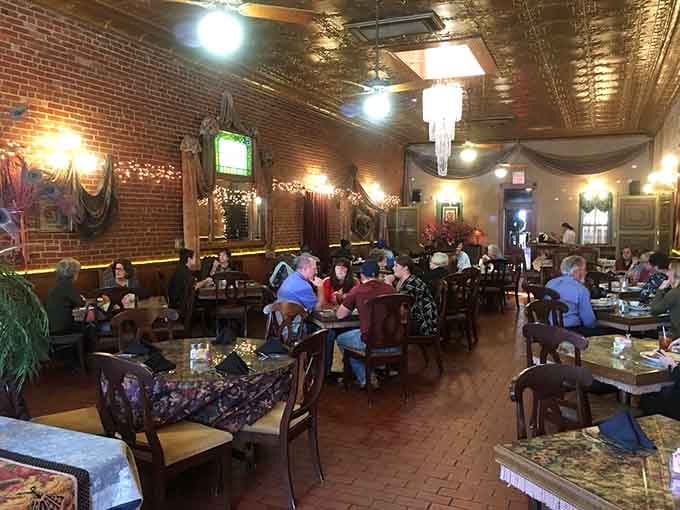 Locals and visitors alike fill the tables, united in their appreciation for food that exceeds all reasonable expectations here.