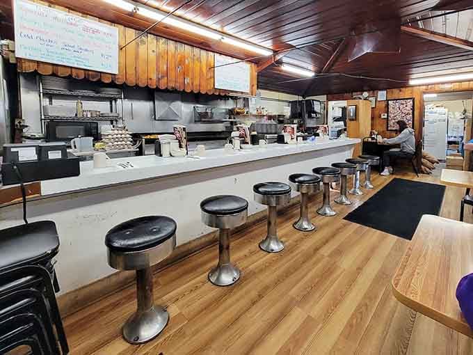 That counter setup is pure old-school diner efficiency, where orders fly and coffee flows like a caffeinated river of joy.