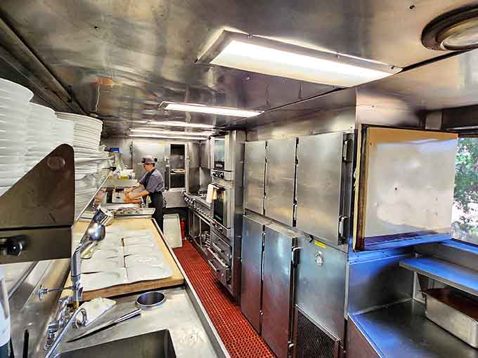 Behind the scenes, chefs work culinary magic on a moving stage, making gourmet meals look effortless.