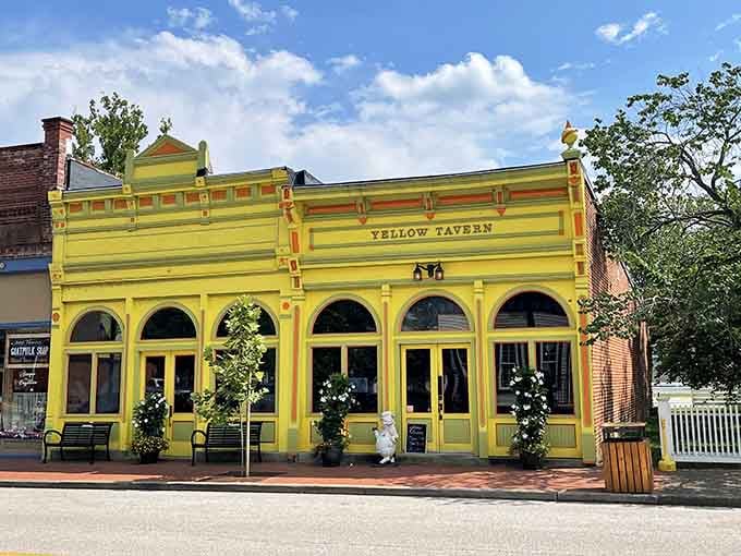 Cheerful yellow paint makes this tavern stand out like sunshine on a cloudy day along the streetscape.