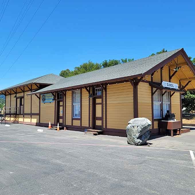 The restored station building looks ready for its close-up, maintaining that authentic small-town railroad depot character perfectly.