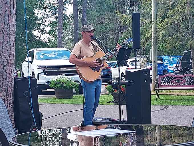 Live music under the pines transforms dinner into an event, because good food deserves an equally good soundtrack.