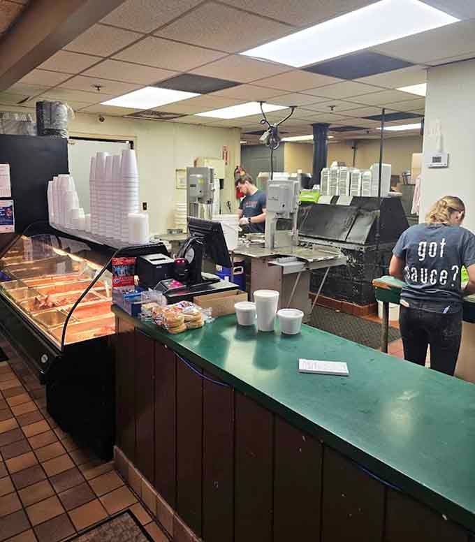 Behind the counter, the team keeps the barbecue flowing and the customers smiling.