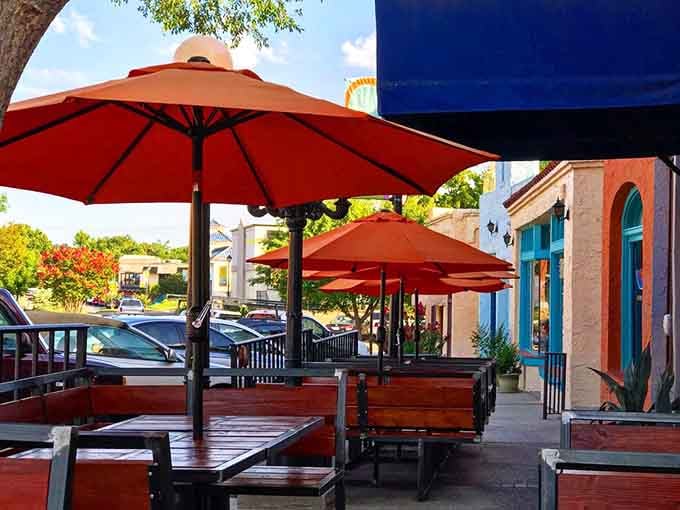 The outdoor patio with its cheerful orange umbrellas offers the perfect stage for Oklahoma's famously dramatic sunsets and people-watching performances.