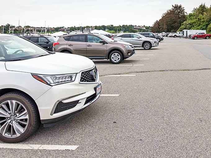 Even the parking lot offers glimpses of Newport Harbor. Your car gets a view that would cost millions if it were attached to a house.