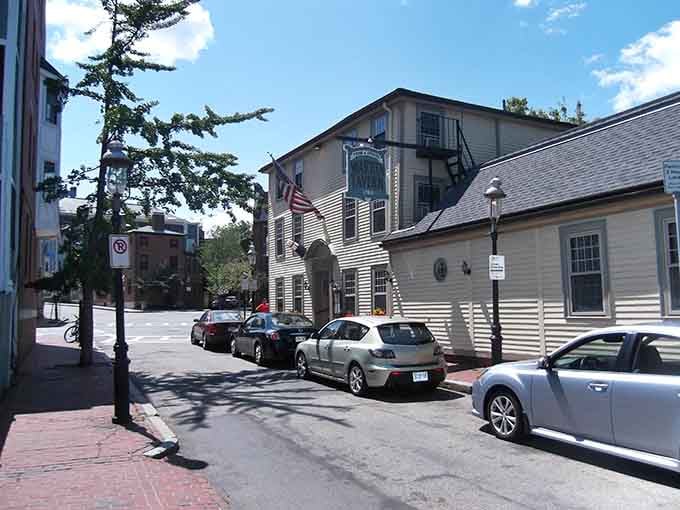 The tavern sits nestled among Charlestown's historic streets, where modern cars park where once horses and carriages would have waited.