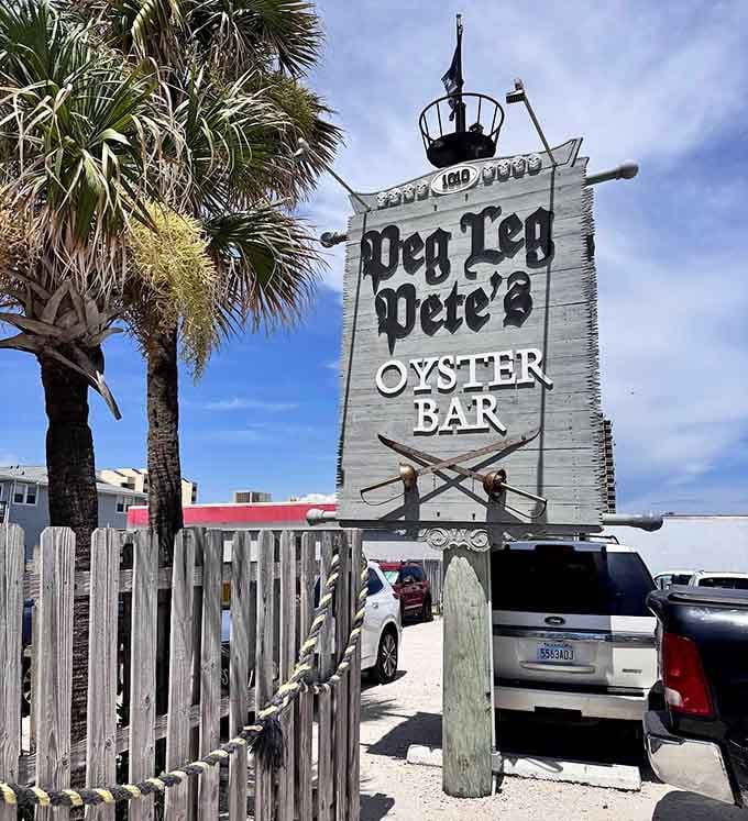 The Peg Leg Pete's Oyster Bar sign standing proud against blue skies, calling seafood lovers like a delicious beacon of hope.