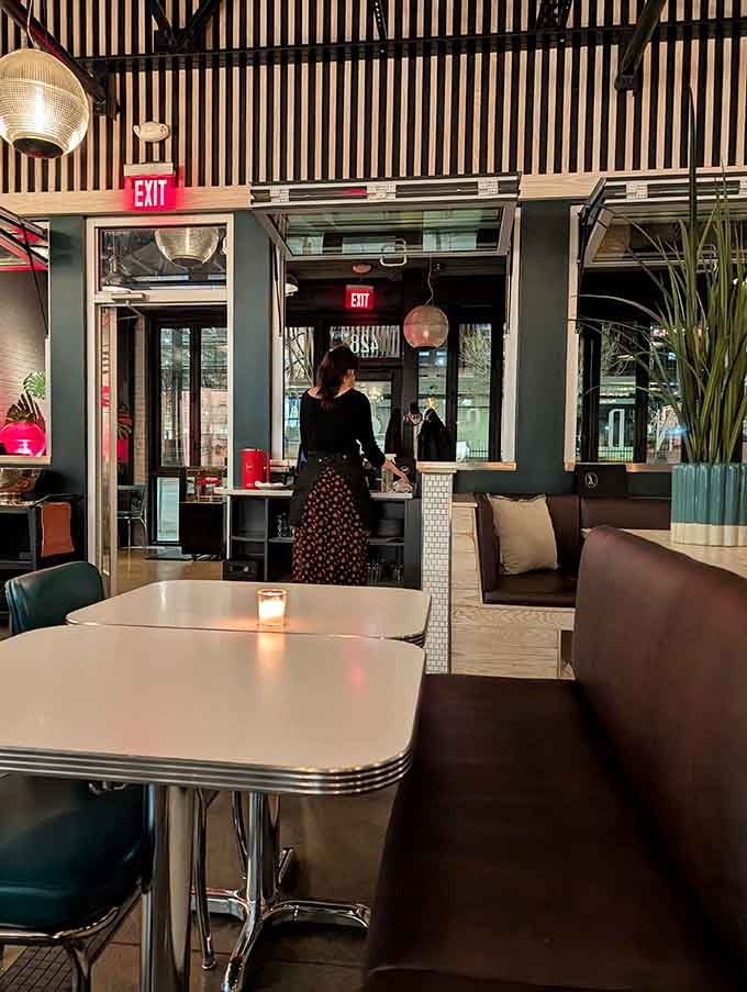 Booth seating that invites lingering conversations over multiple courses and possibly another round of mac and cheese.