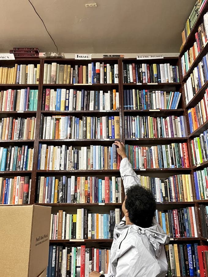 Shelves so tall they require either a step stool or the optimism of a determined book hunter.