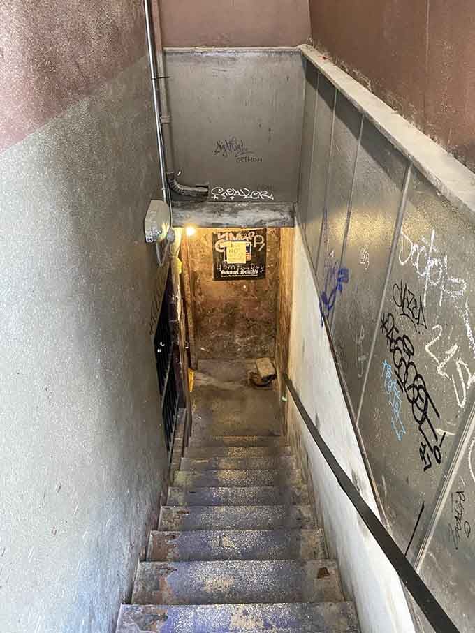 Those stairs leading down whisper "adventure awaits," though the graffiti adds "but watch your step, friend."
