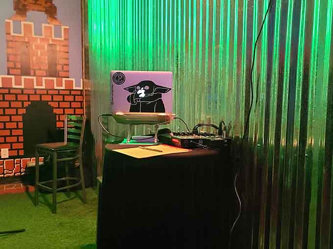 A DJ booth that looks like it teleported straight from a retro video game level into downtown Macon reality.