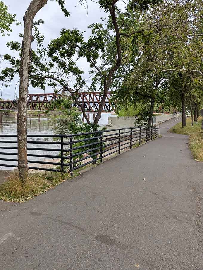 Paved pathways wind along the water's edge, inviting walkers and bikers to explore Sacramento's best-kept natural secret today.