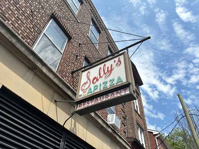 That vintage signage has been guiding hungry souls to apizza paradise longer than most restaurants have been alive.