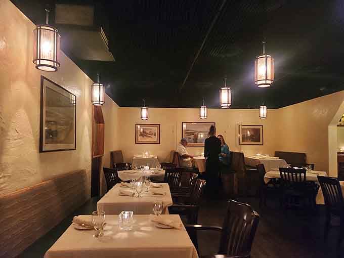 Crisp white tablecloths and warm lighting set the stage for memorable meals and even better dinner conversations.