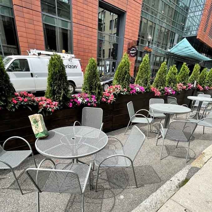 Outdoor seating with flower boxes brings a touch of charm to your pastrami-eating experience on pleasant Boston days.
