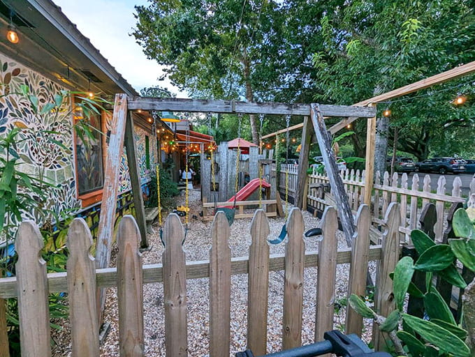 The playground area ensures kids stay entertained while parents savor their pizza in this family-friendly artistic oasis.