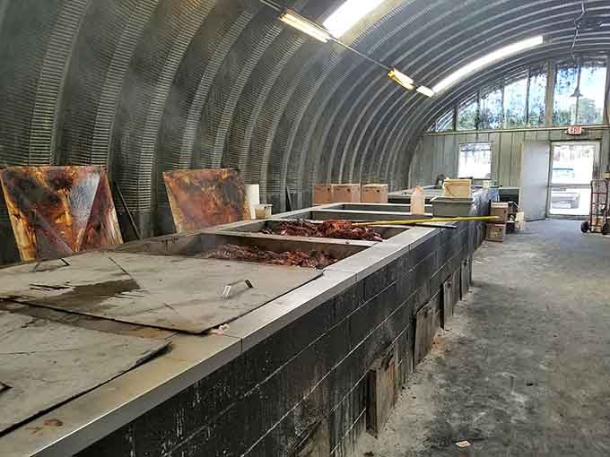 The massive pit house where the real magic happens overnight, turning whole hogs into legendary barbecue through patience and skill.