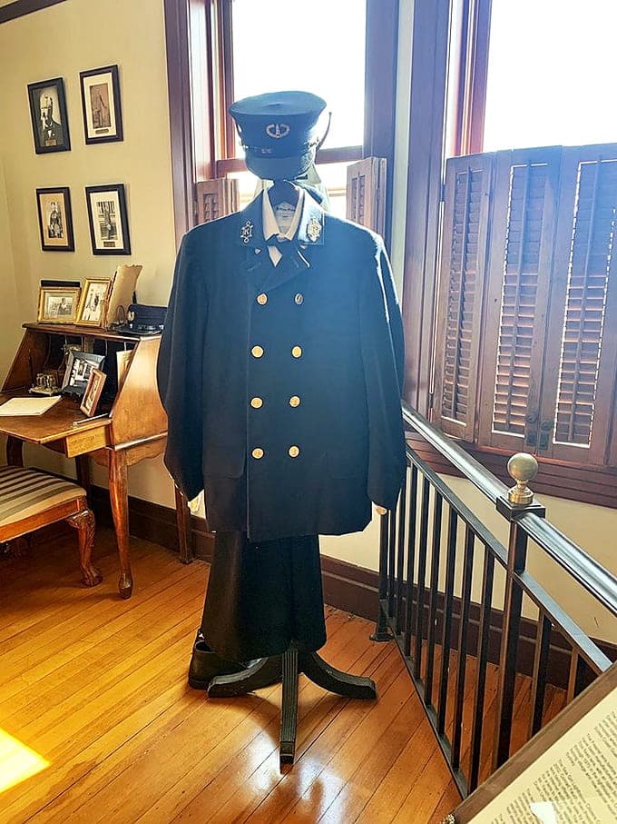 The keeper's uniform stands ready, a reminder that this wasn't just a house but a vital maritime station.