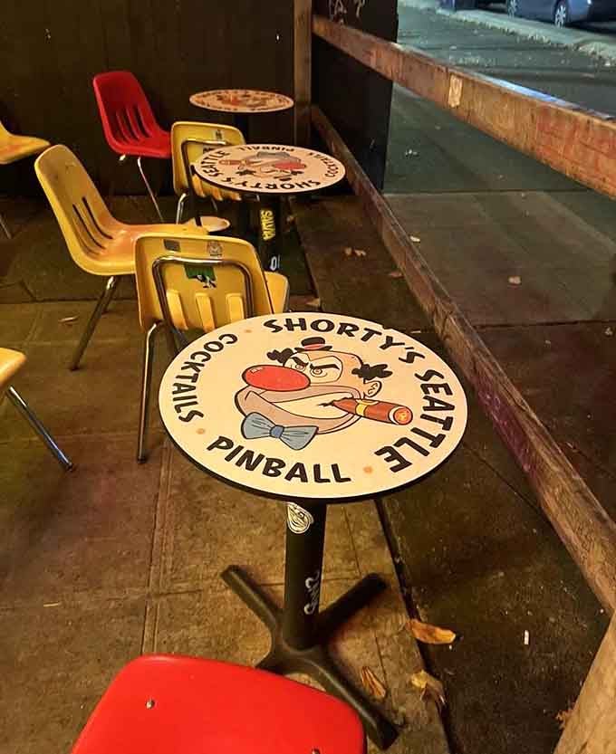 Custom tables featuring Shorty's mascot remind you that even your seating comes with personality and a side of whimsy.