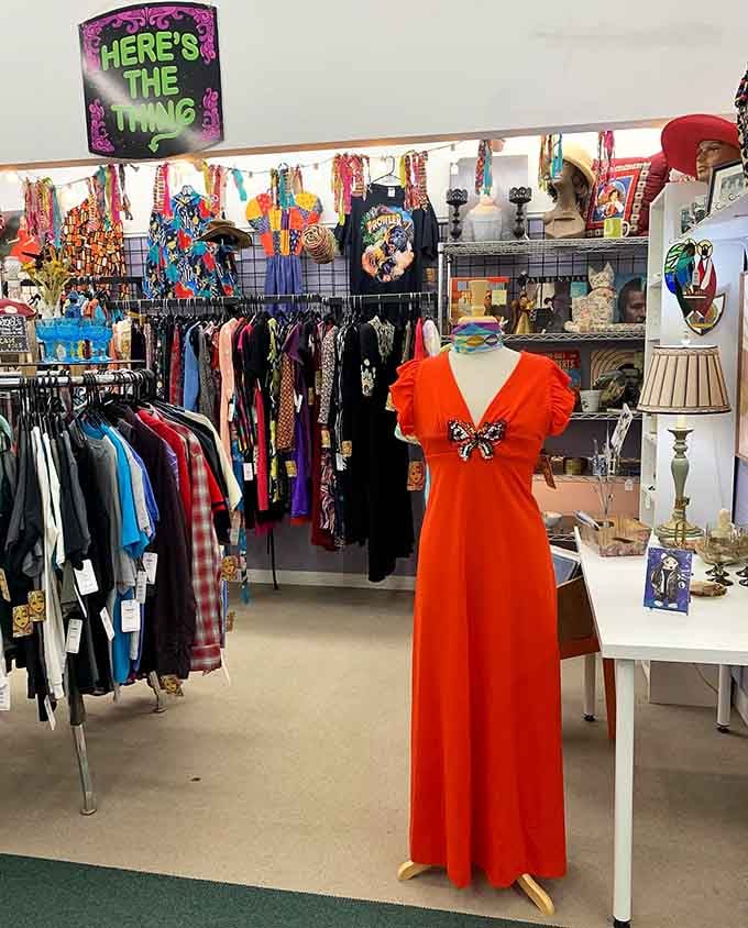 That orange dress practically screams disco era, complete with butterfly details for maximum groovy vibes.