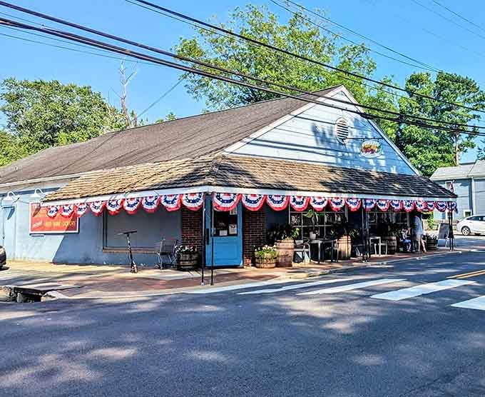 Patriotic bunting decorates this local shop like it's perpetually celebrating something worth remembering.