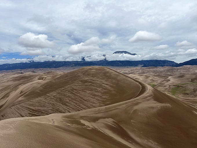 Clouds rolling over Star Dune like the landscape can't decide between desert drama and mountain majesty.