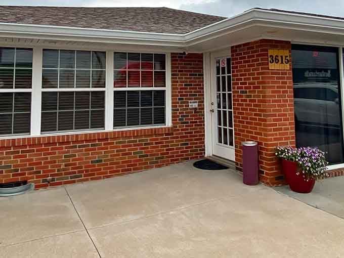 Brick apartments like this one offer affordable living with thoughtful touches like flower pots that make a house feel like home.