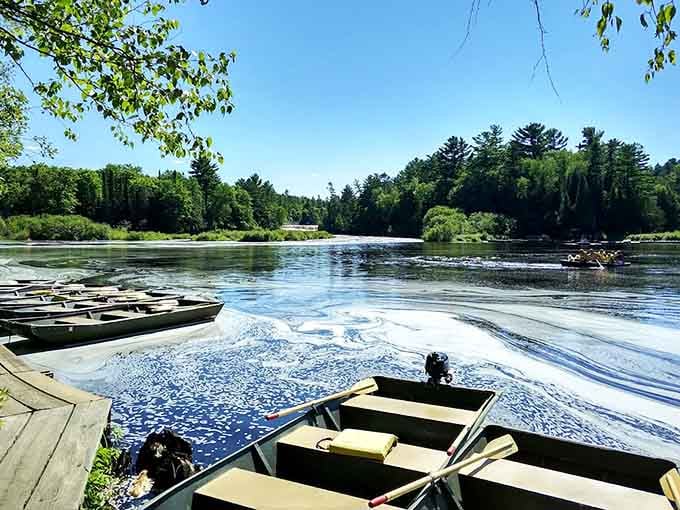 Rowboats wait patiently at the dock, ready to take you right up to the cascading water.