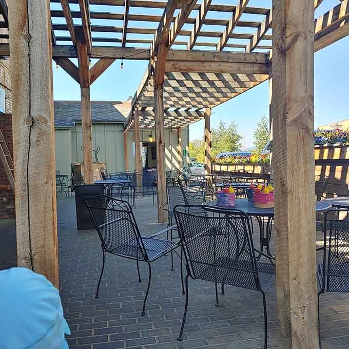 The outdoor patio with pergola provides mountain views and fresh air, perfect for lingering over your meal.