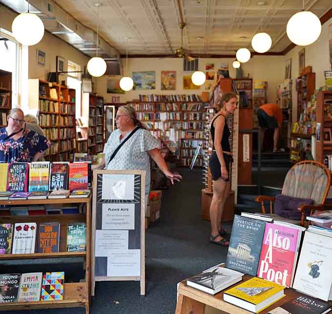 Happy browsers wandering the aisles with that contented look that only comes from being surrounded by endless reading possibilities.