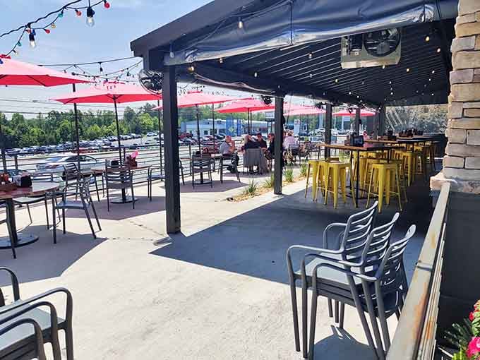 The covered patio with yellow stools offers prime people-watching real estate while you work through that impressive menu selection.