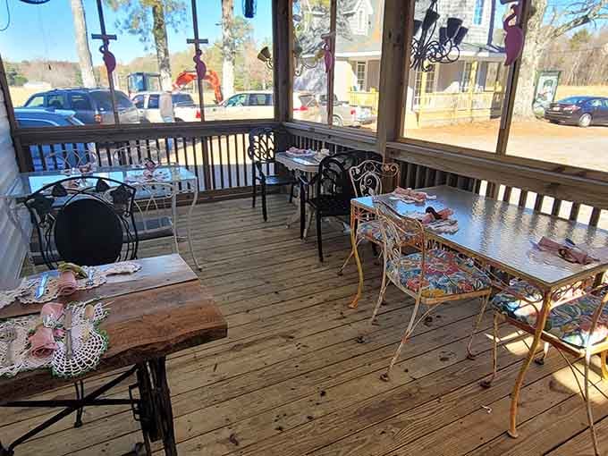The screened porch offers al fresco dining with mismatched furniture that somehow feels more intentional than any matching set could.