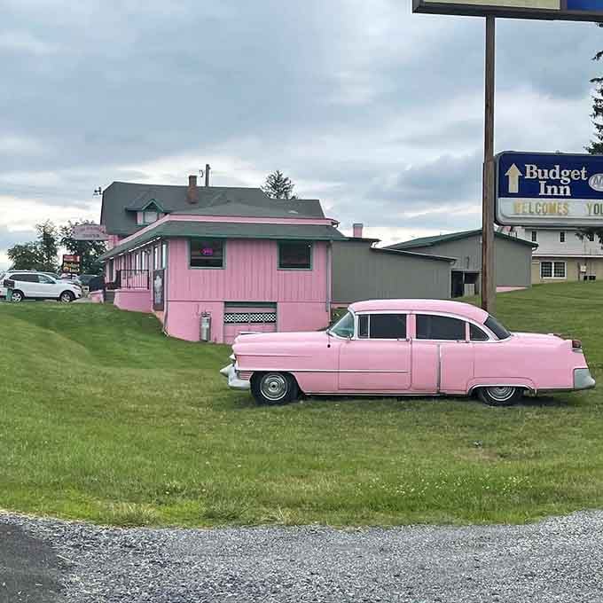 That pink Cadillac parked outside isn't just decoration, it's a promise of the time-traveling experience waiting inside.