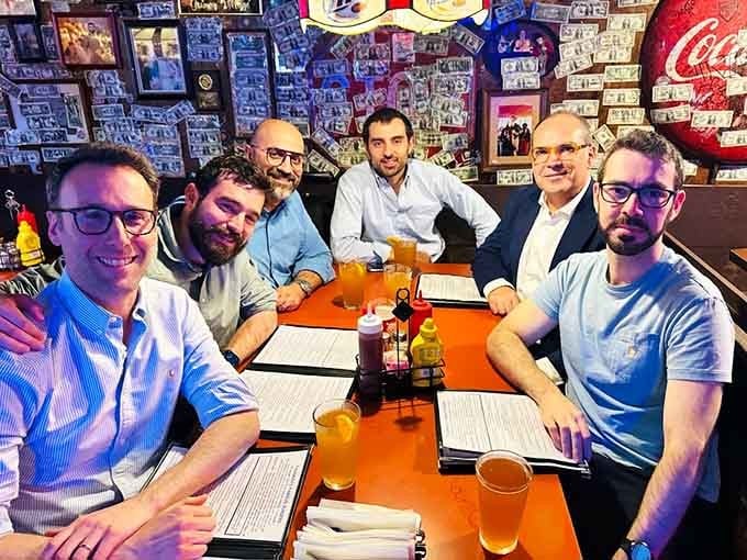 These brave souls gather for what appears to be either a business meeting or a burger intervention.