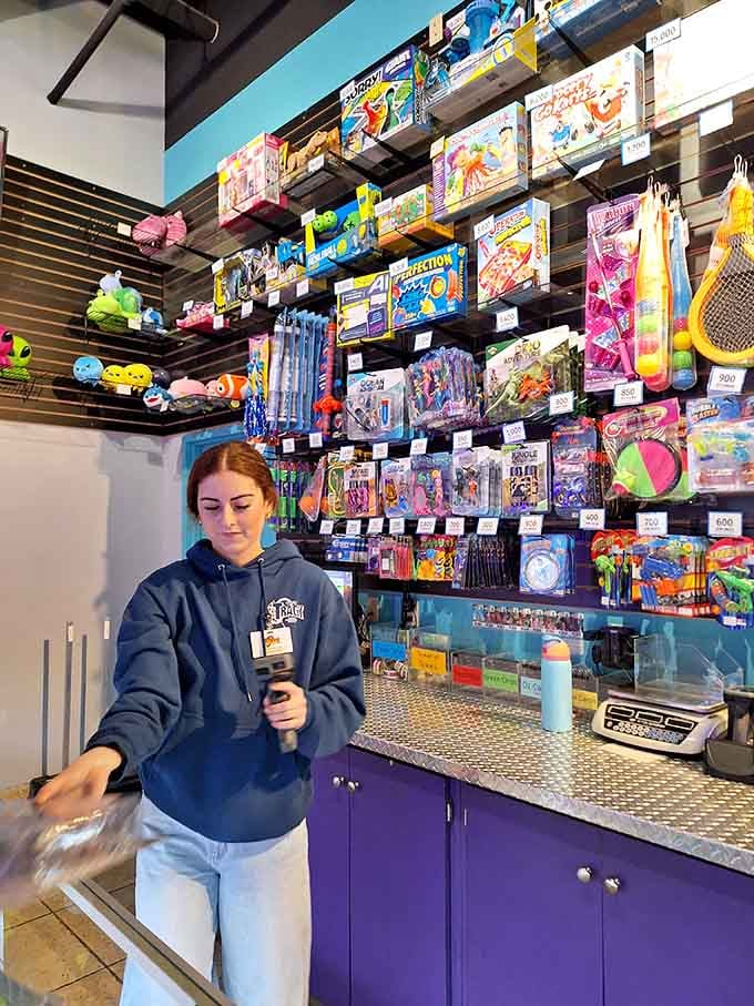 The prize redemption counter, where tickets become treasures and kids learn that winning isn't everything, but it sure helps.