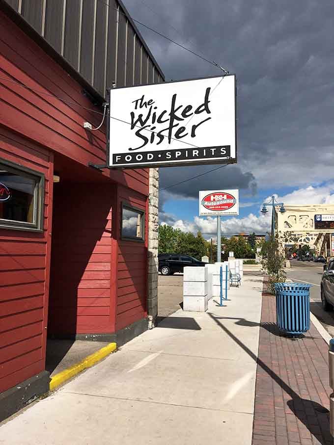 The entrance beckons from the sidewalk, promising creative food adventures just beyond that red exterior and white sign.