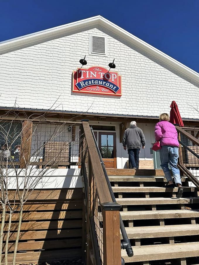 The red Tin Top sign hangs proudly, marking the spot where Bon Secour's fishing heritage meets serious eating.