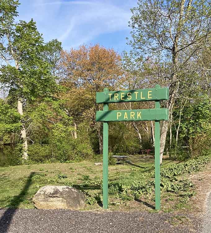 Trestle Park's simple green sign promises adventures that are anything but simple once you step onto its trails.