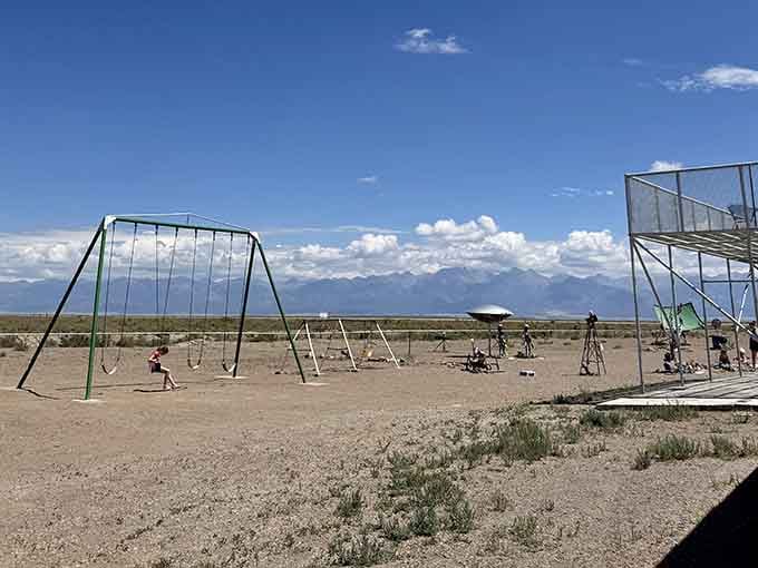 Even alien watchers need playground equipment, because waiting for UFOs requires patience and occasional swing breaks.