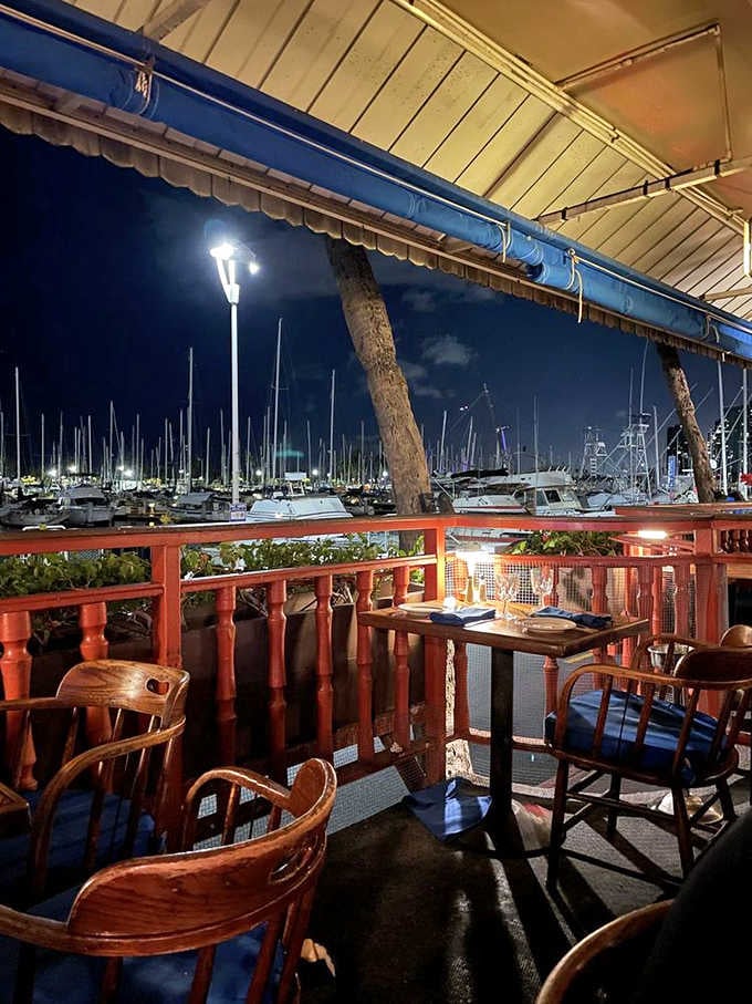 As night falls, the yacht harbor transforms into a twinkling wonderland &ndash; nature's own dinner theater visible from waterfront tables.