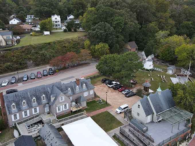 An aerial perspective reveals how the historic village integrates battlefield preservation with charming colonial-era buildings and that distinctive windmill.