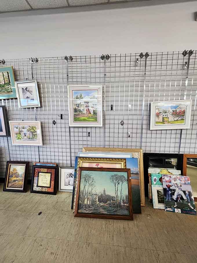 Wall art gallery where landscapes, portraits, and the occasional sports memorabilia create a visual buffet for bare walls everywhere.