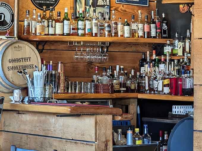 The bar area showcases an impressive spirits collection. Because sometimes the perfect pairing for smoked meat isn't wine&mdash;it's a carefully selected bourbon.